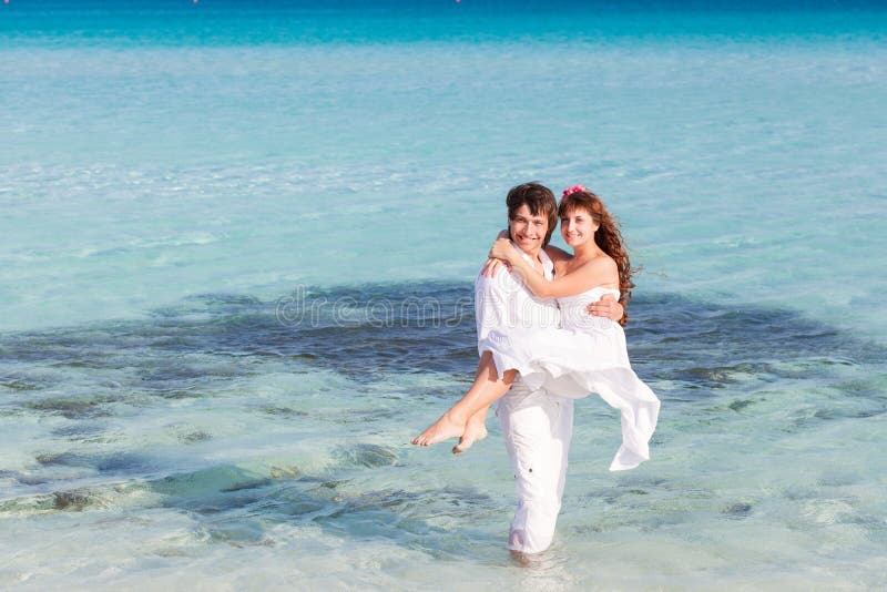 Just Married Couple in the Sea Stock Image - Image of idyllic, holding ...