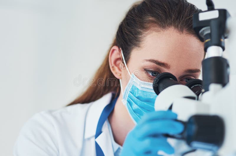 It Just Takes One Long Look. a Focused Young Female Scientist Looking ...