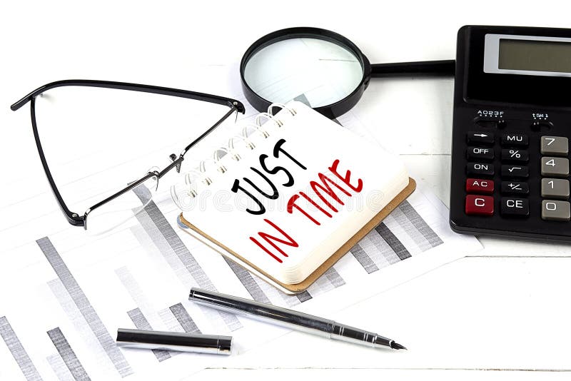 JUST in TIME Text on Notebook with Calculator on Diagram Background ...