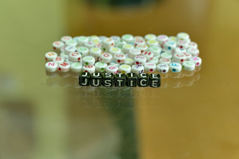 JUSTICE Written with Acrylic Black Cube with White Alphabet Beads on ...