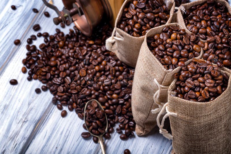 Jute Bags Filled with Coffee and Silver Spoon Stock Image - Image of ...