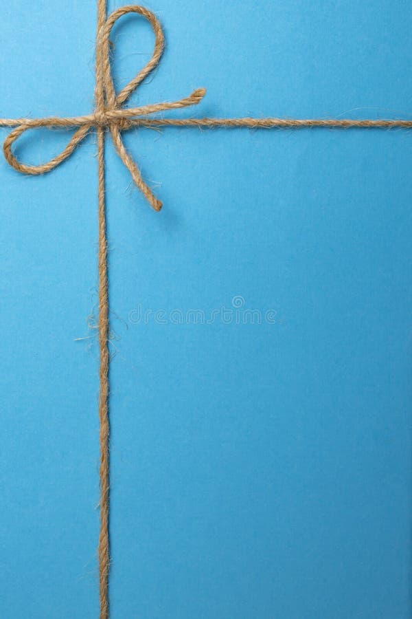 Jute String Bow and Framing Lines on Blue Paper Texture Stock Image ...