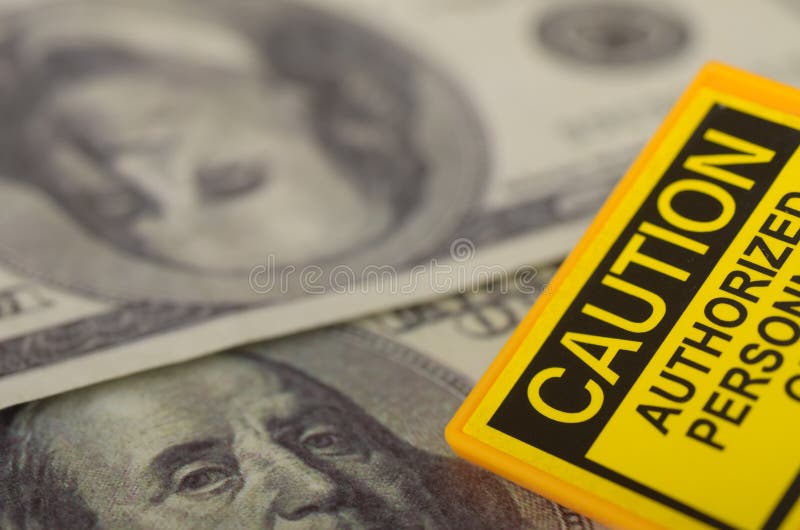 The "CAUTION" Sign with the Blurred Dollar Bills Highlights the ...