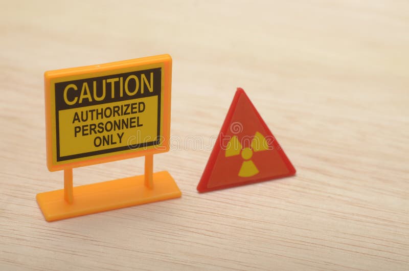 The "CAUTION" Sign and the Radiation Symbol Highlights the Potential ...