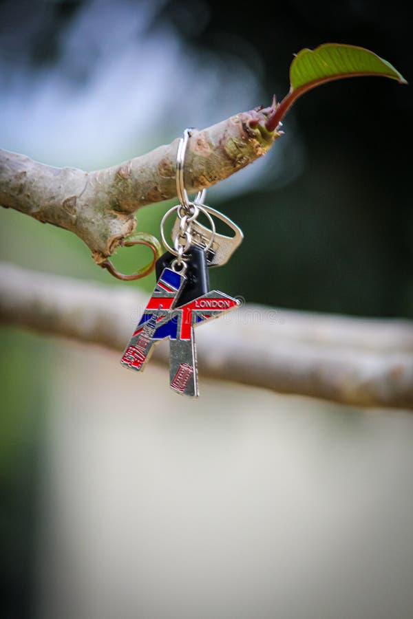 K alphabet keyring on tree stock image. Image of initials - 191414655