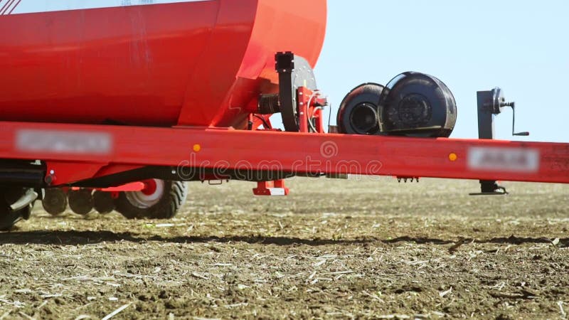 4K. Close-up of a Tractor with a Seeding Complex Working in the Field ...