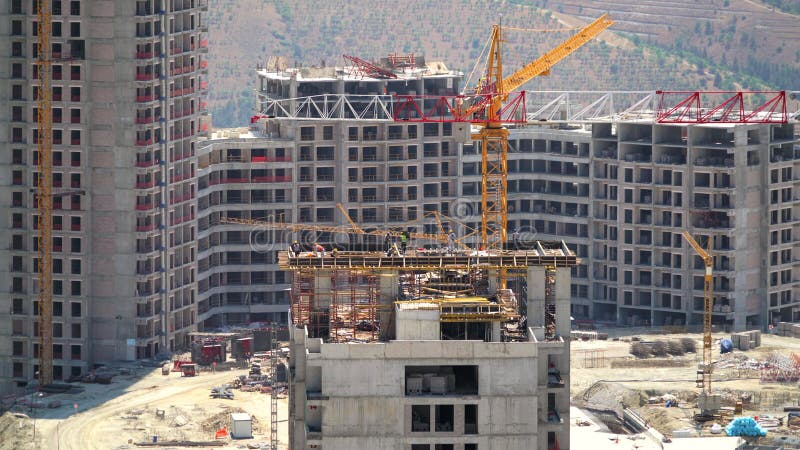 8K Cranes and Construction Workers Working at Worksite Stock Video ...