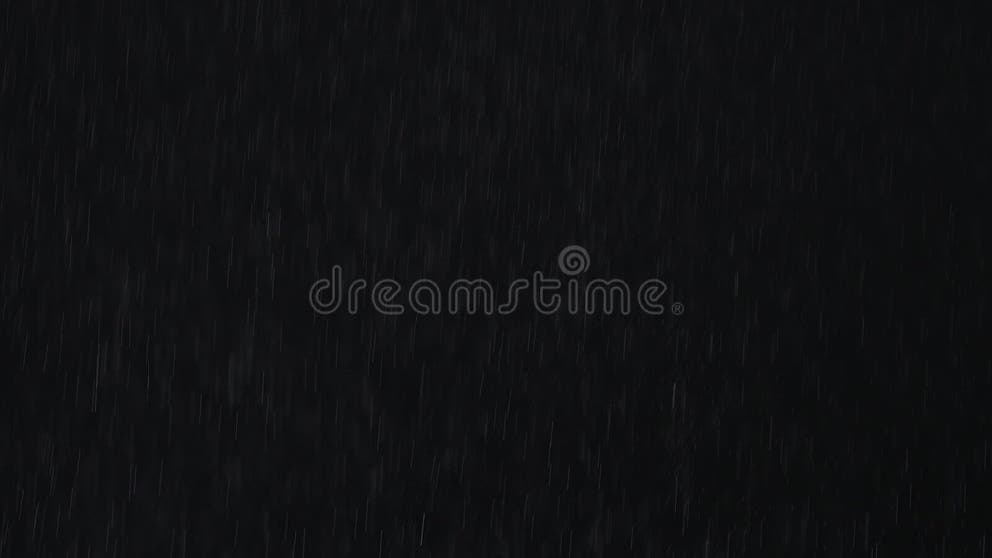 4k Heavy Angled Rain Falling in Front of the Camera Against Black ...