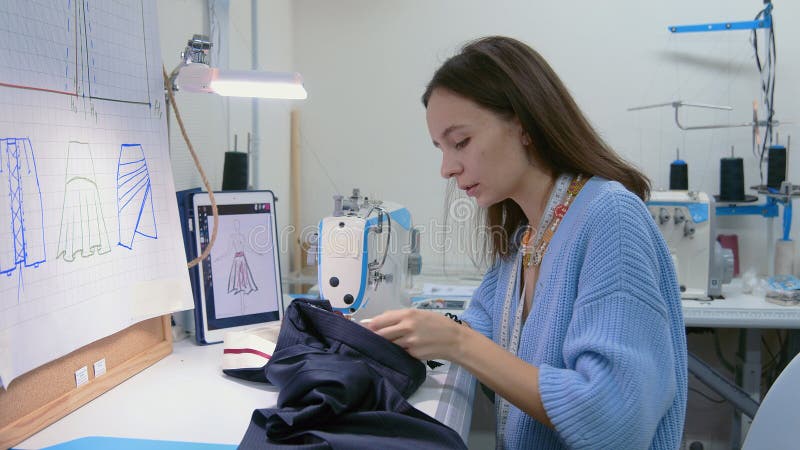 4K. the Master of Sewing Clothes in His Atelier Stock Photo - Image of ...