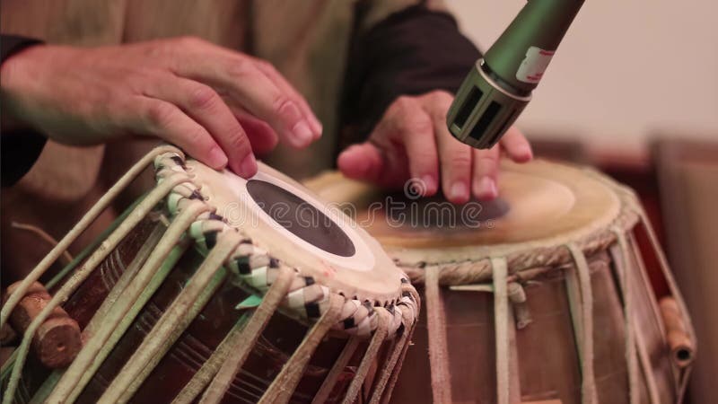 4K Medium Close Up of a Mans Hands Tapping Out a Rhythm on a Pair of ...