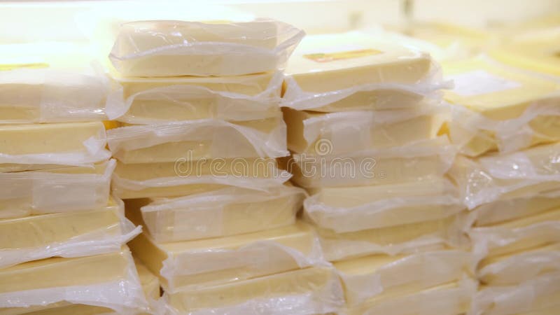 4k. Packaged Pieces of Cheese on Shelves in Supermarket Stock Footage ...