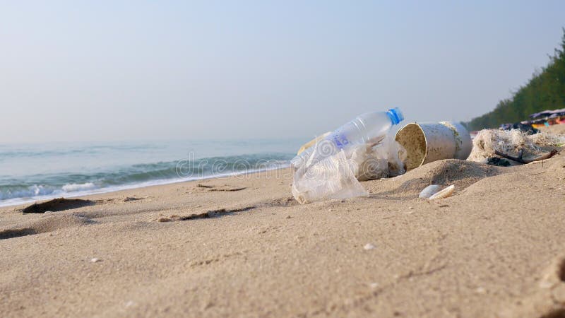 Plastic Pollution: Discarded Bottles Littering a Pebble Beach by the ...