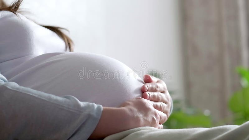 4k Top View Pregnant Expectant Mother Caressing Her Belly Woman Hands