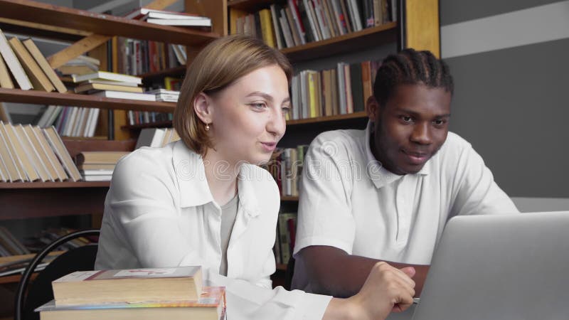 4K. Students Study Together in the Library. Students Prepare for Exams ...
