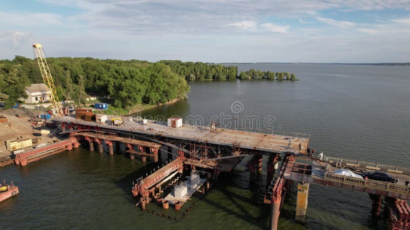 4K Top View of the Construction of a Bridge Across the River ...