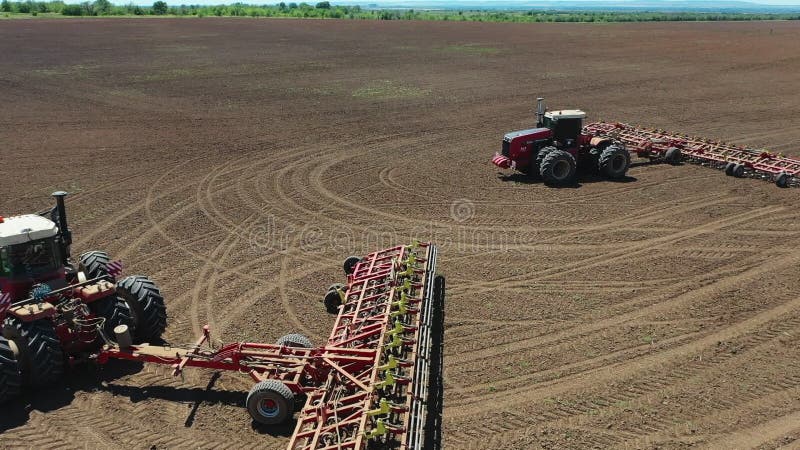 4K. Tractor with a Sowing Complex Works in the Field Stock Footage ...