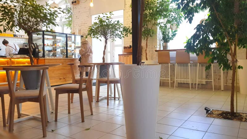 4k, Video, Modern Interior of a City Cafe with Tables and Chairs ...