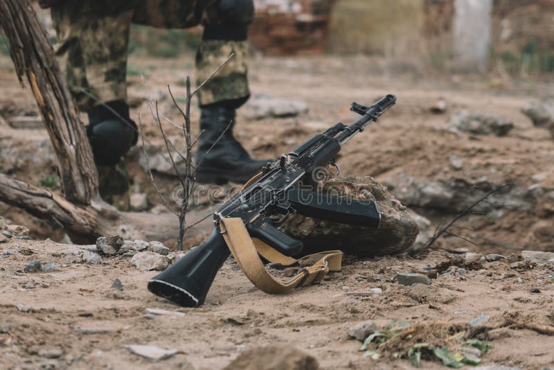 Kalashnikov Assault Rifle on the Ground. Firearms Lying on Ground ...