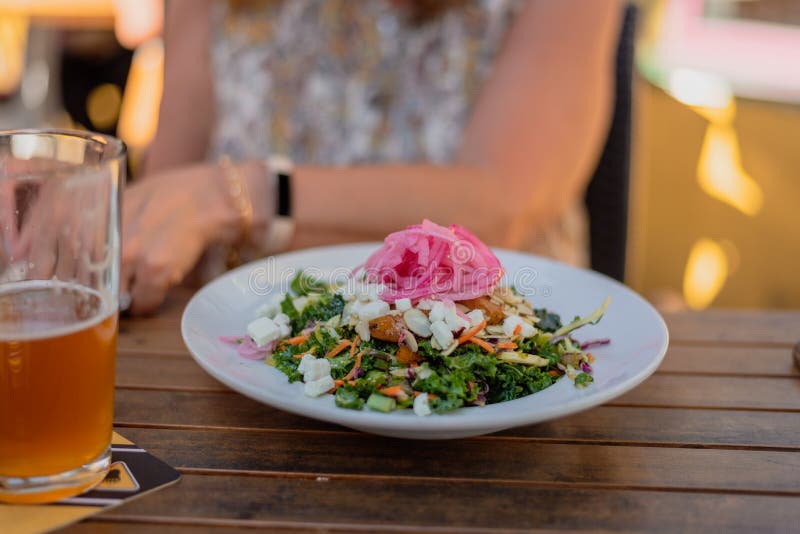 Kale salad on wood table stock image. Image of diet - 154921725