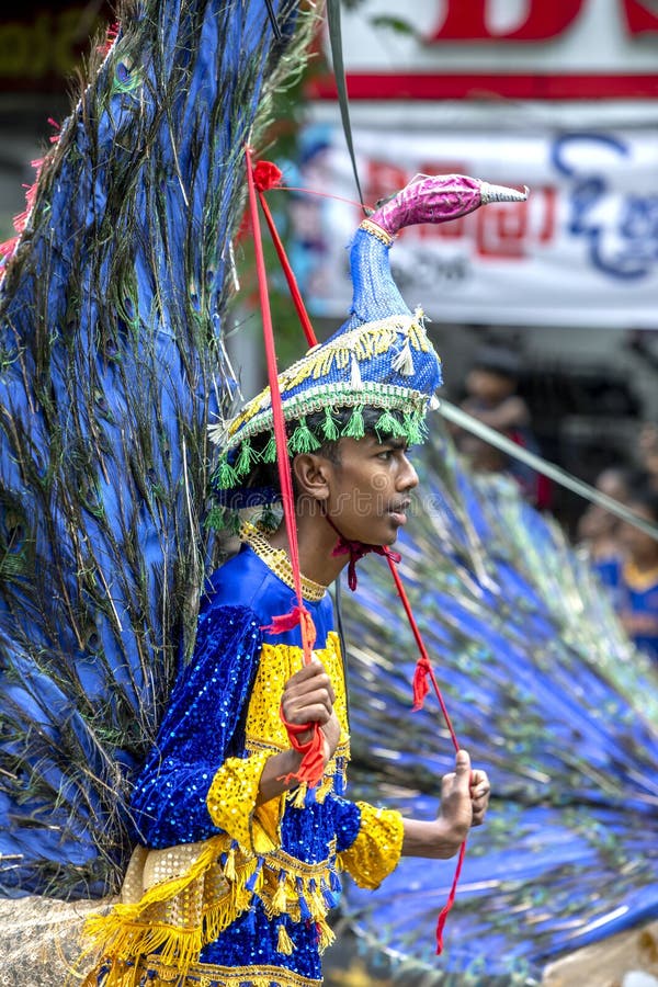 A Peacock Dancer Performs Along the Streets of Kandy in Sri Lanka ...