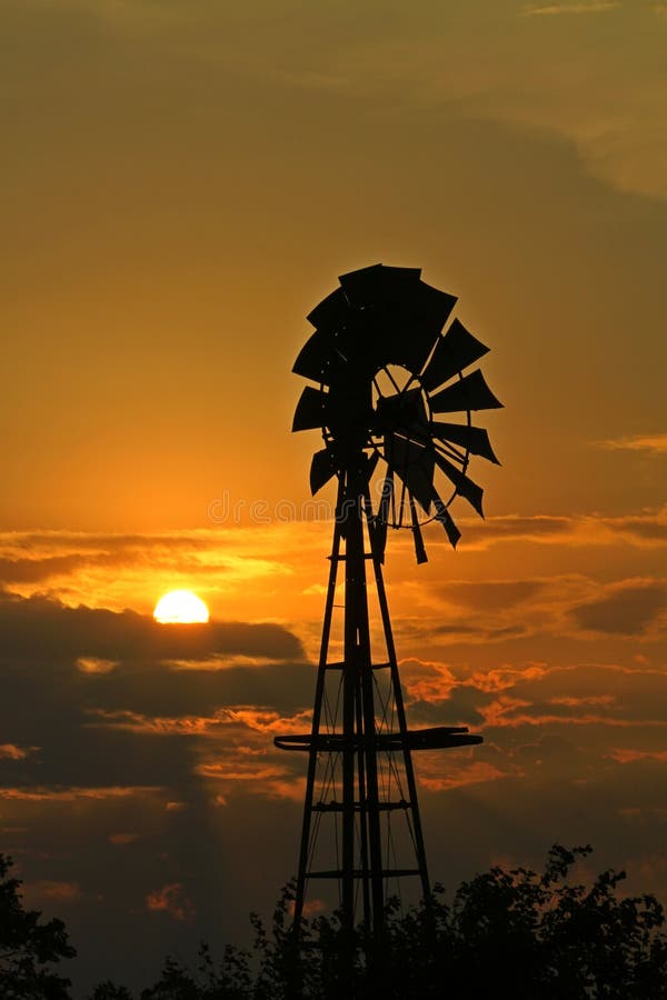 Windmill at sunset stock photo. Image of farm, clouds - 65514256