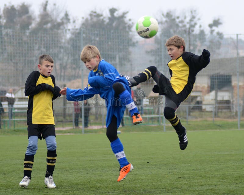 Little Child Playing Football or Soccer Editorial Stock Photo - Image ...