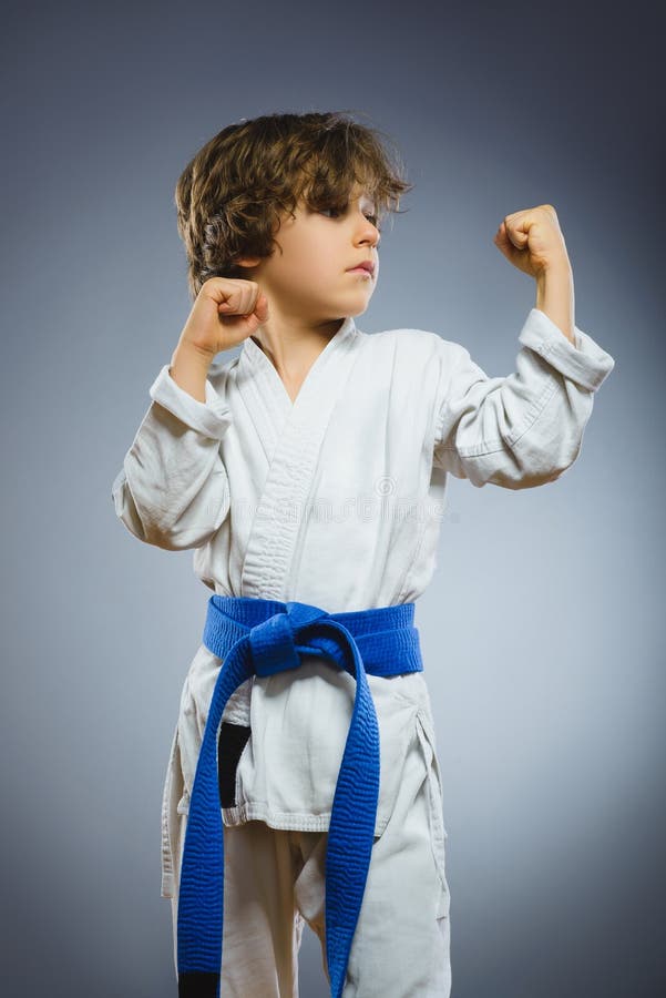 Karate Boy in Kimono Fighting Isolated on Gray Background Stock Photo ...