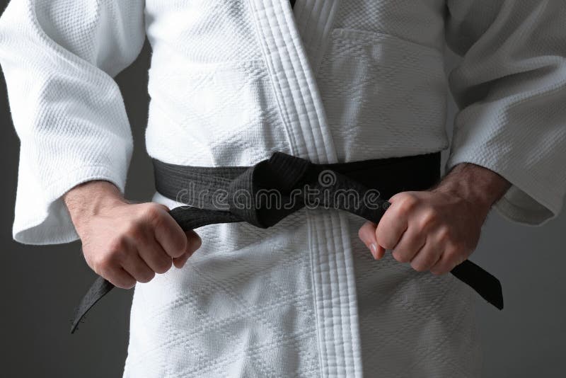 Karate Kid Wearing White Gi and Belt in a Side Split Side Straddle ...
