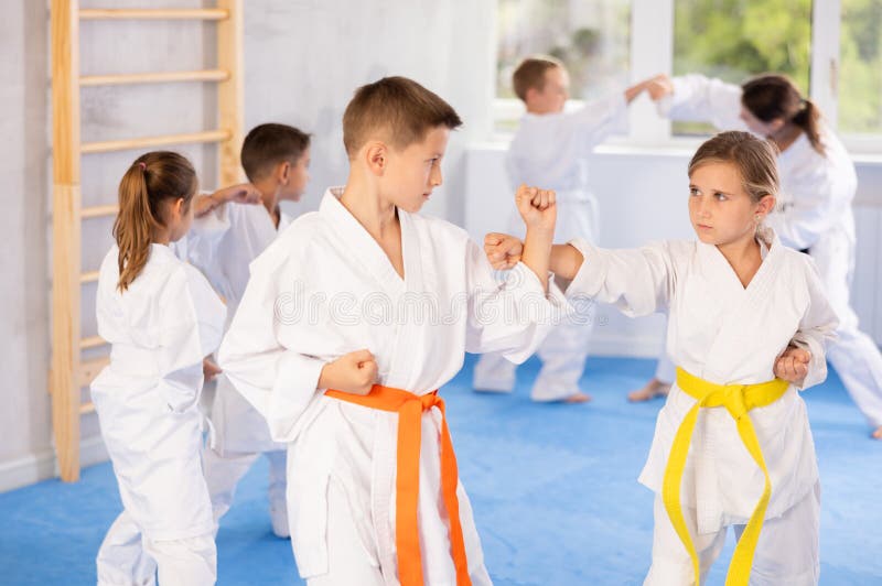 Karate Kids in Kimono Sparring Together during Their Group Karate ...