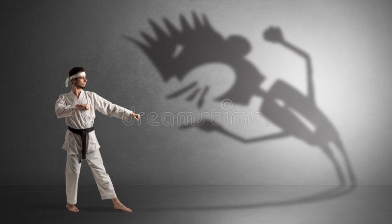 Karate Man Fighting with a Big Scary Shadow Stock Photo - Image of ...