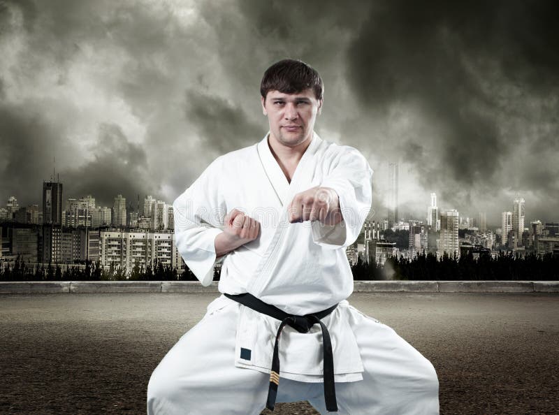 Karate master in kimono stock photo. Image of position - 76076916