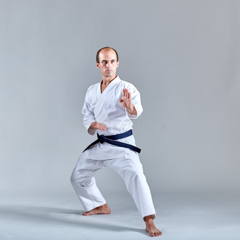 In the Karate Rack, an Adult Athlete Trains a Formal Karate Exercise ...