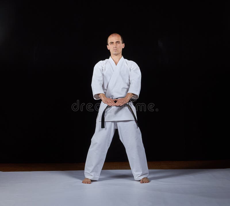 In the Karate Stand is an Athlete with a Black Belt Stock Image - Image ...