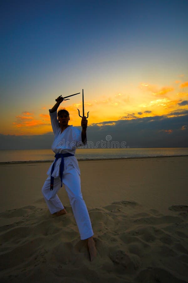 Karate on sunset beach stock image. Image of black, human - 25404367