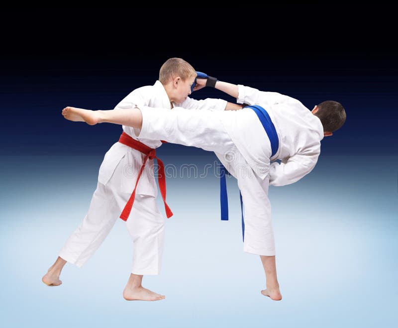 In Karategi Athletes are Hitting Punches and Kicks Stock Image - Image ...