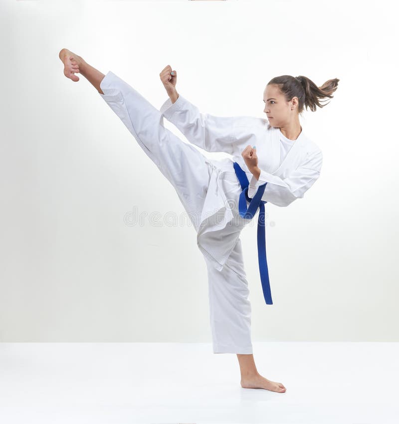 In Karategi, a Sportswoman Strikes a Kick Stock Photo - Image of ...