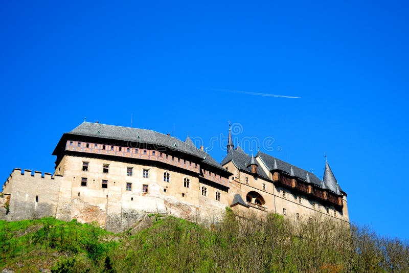 Karlstejn Castle, Panorama of the Karlstejn Castle over blue sky during ...