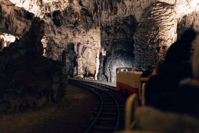 Karst cave with a railway stock photo. Image of geologist - 271834490
