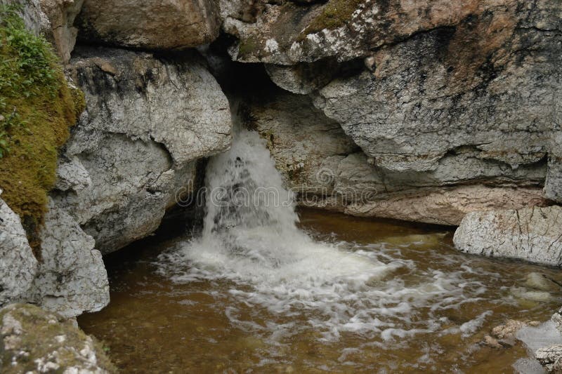 Karst Rocks in the Reserve with a Falling Stream of Water Stock Image ...