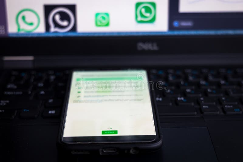 WhatsApp Terms of Service on a Smartphone Against a PC Computer ...