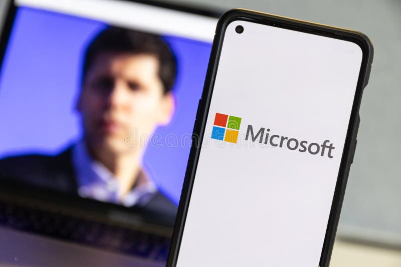 Microsoft Logo and Sam Altman in Background on Screen.Microsoft Hires ... Microsoft Logo and Sam Altman in Background on Screen.Microsoft Hires ...