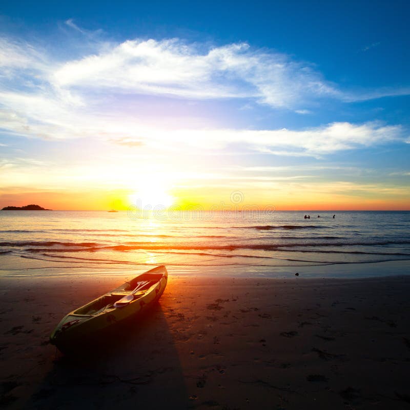 Canoe on the Ocean Beach during the Amazing Sunset. Stock Photo - Image ...