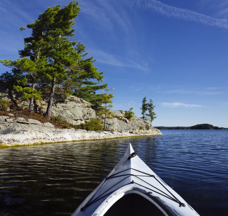 A Fisherman S Canoe on Rocky Shore in Northern Minnesota Lake Stock ...