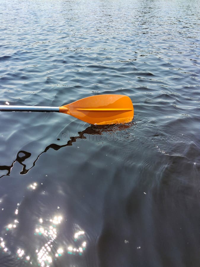 Kayak Paddle Over Water with Sun Glare. View from Above Stock Image ...