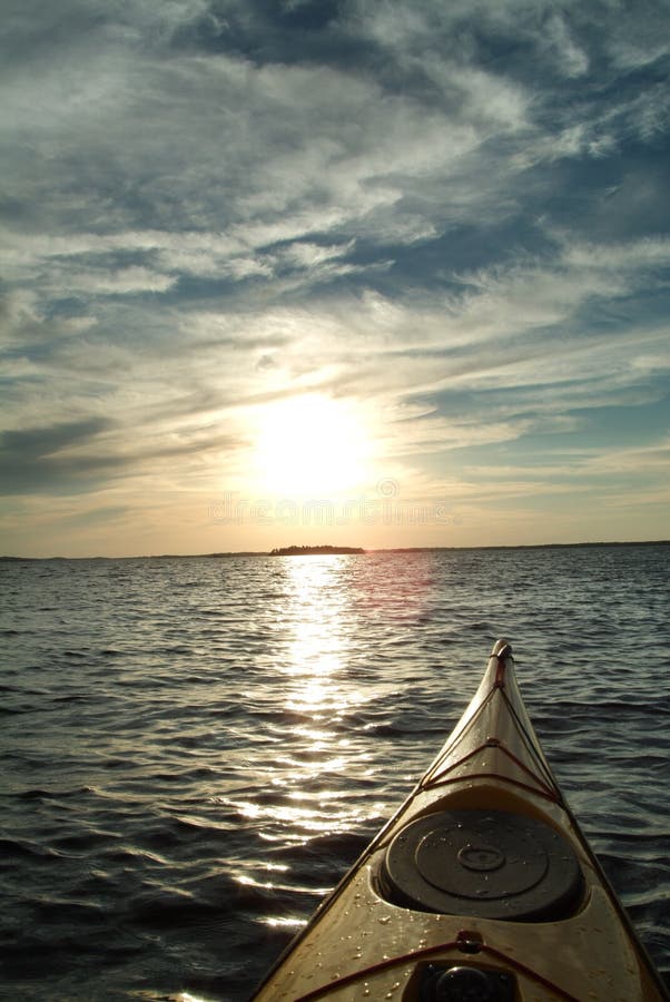 Kayaking into sunset stock image. Image of sport, waves - 1302839