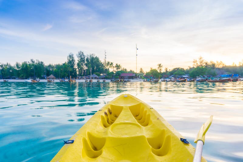 Kayaking at the Tropical Beach with Beautiful Sunset Stock Image ...