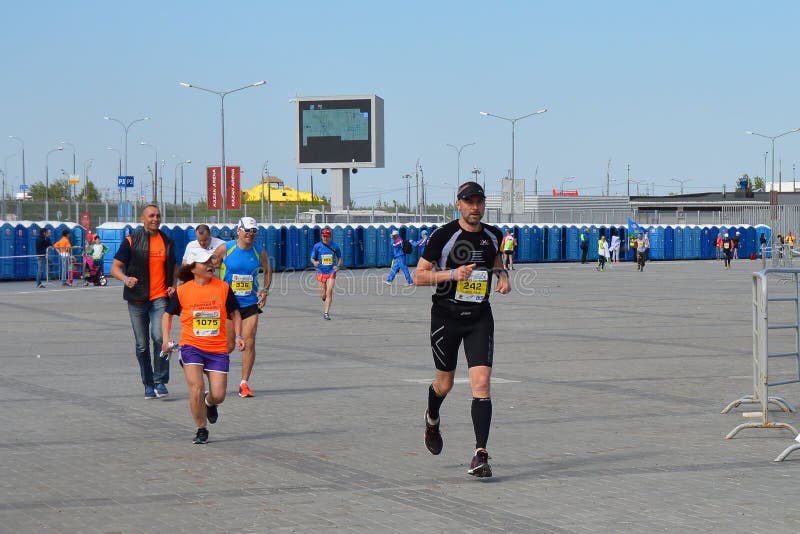 KAZAN, RUSSIA - MAY 15, 2016: Marathon Runners at the Finish Line after ...