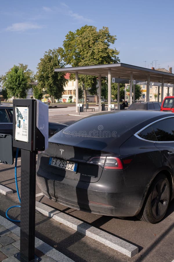 A Static Shot of a Solid Black Tesla Model 3 Dual Motor Charging at the ...