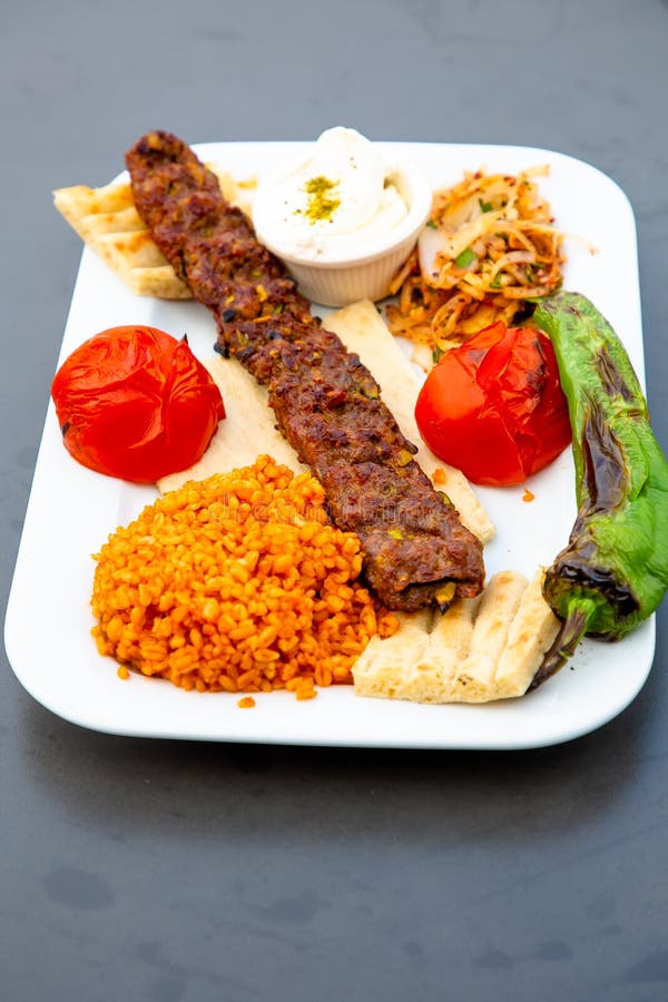 Kebab with Rice and Vegetables is on a Plate Stock Photo - Image of ...