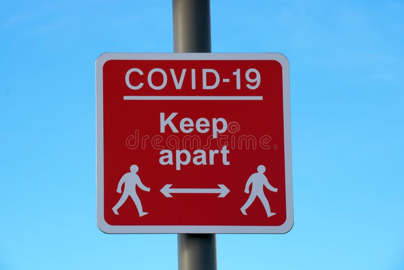 Keep Apart Virus Warning Sign on a Town Street Stock Image - Image of ...